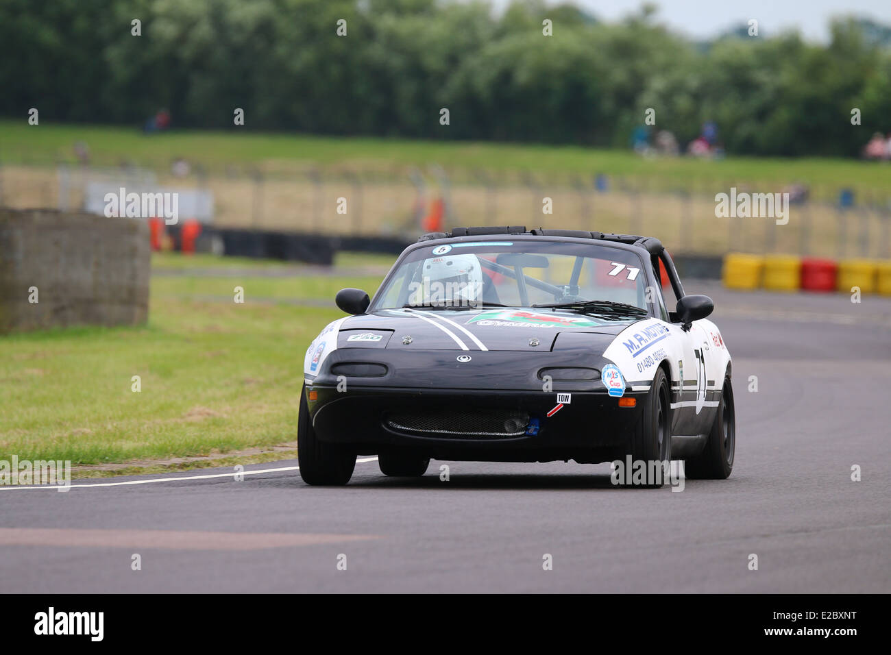Cars racing at Castle Combe Circuit Stock Photo - Alamy