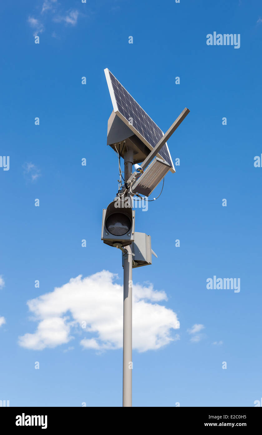 Traffic light and solar cell panel against blue sky Stock Photo - Alamy