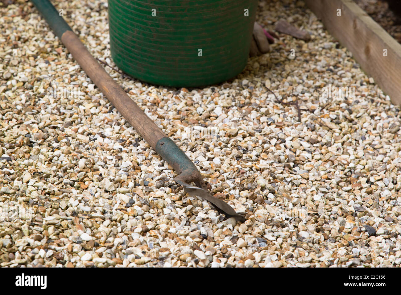 Garden hoe and bucket Stock Photo - Alamy