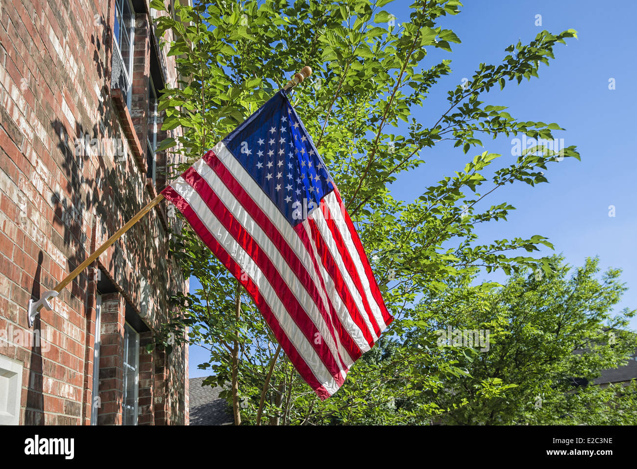 American flag front of house hi-res stock photography and images - Alamy