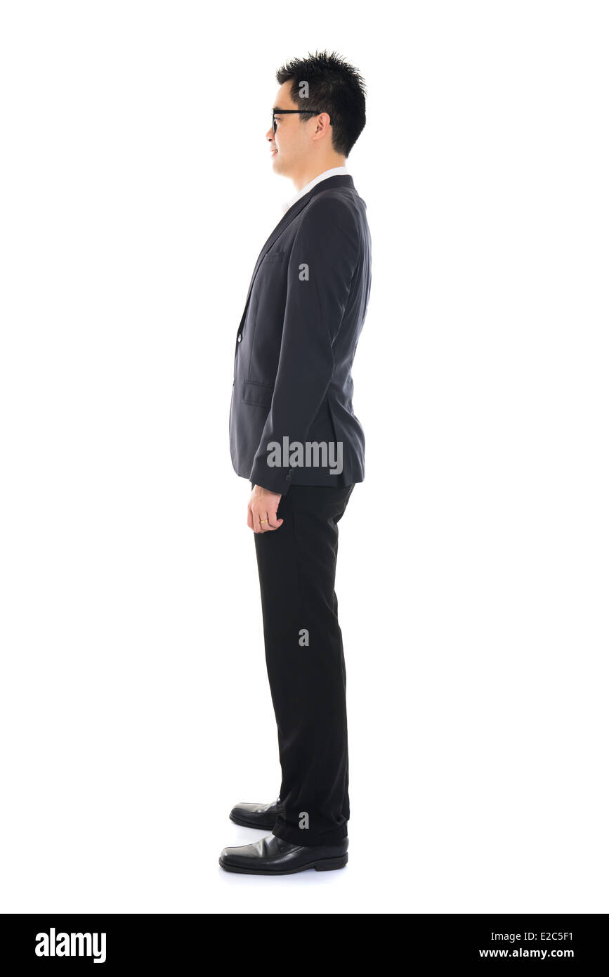 Confident Asian businessman, side view and full length portrait ...