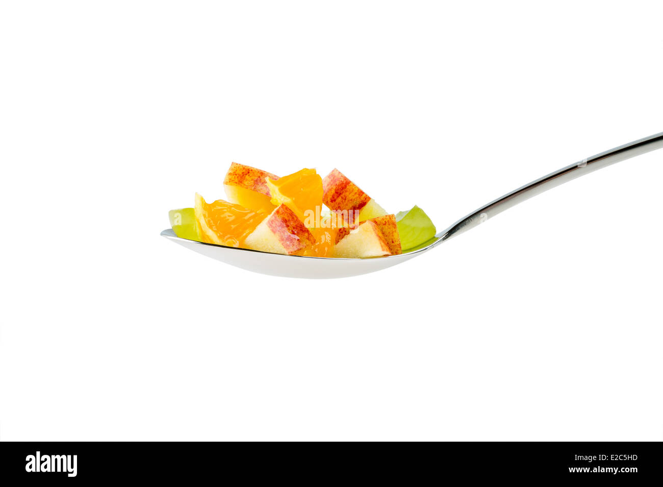 fruit in a spoon isolated on white background Stock Photo - Alamy