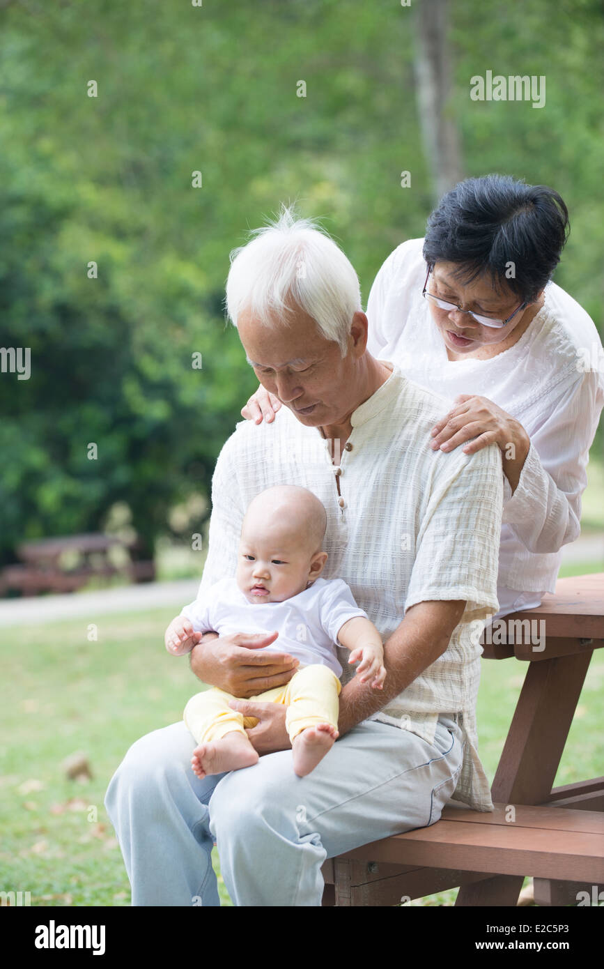 asian grandparents playing with baby grandson at outdoor Stock Photo ...