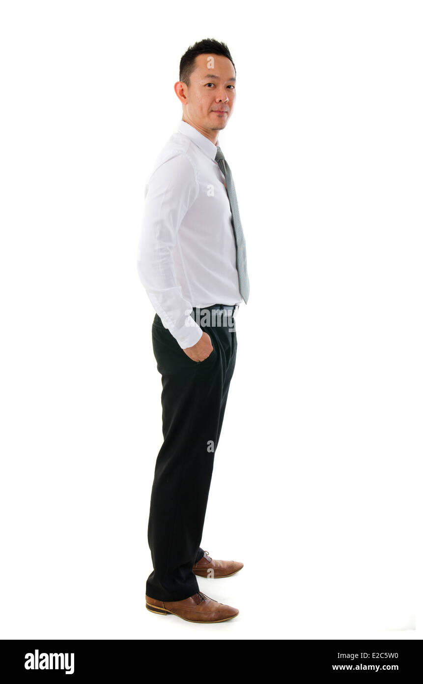 Portrait of smart Chinese Asian business man smiling with hands inside ...