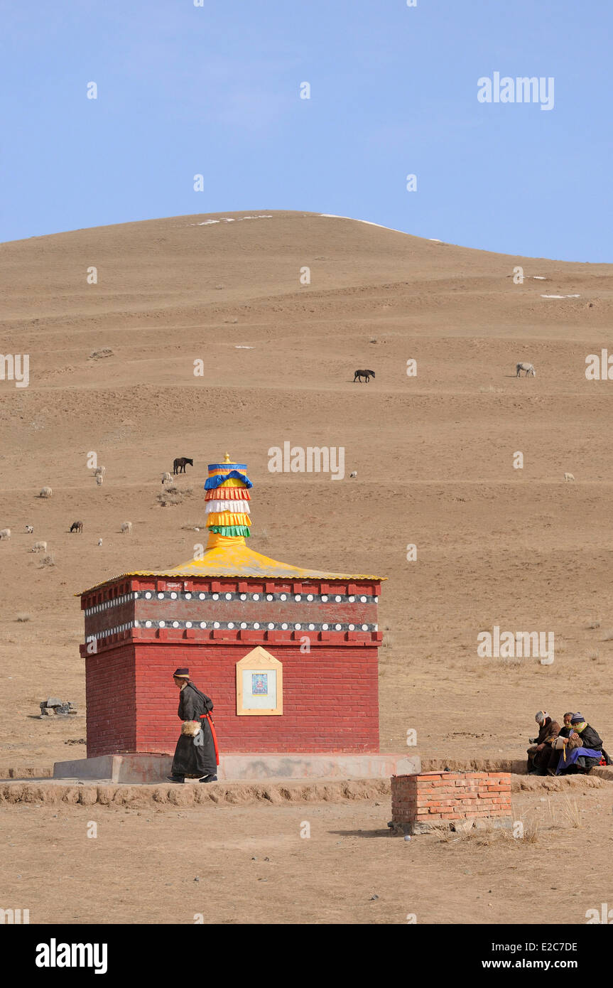 China, Gansu Province, Amdo, Xiahe region, Old woman doing a kora ...