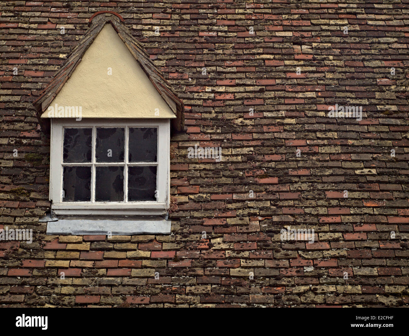 Tiled roof of cottage with dormer window Stock Photo - Alamy