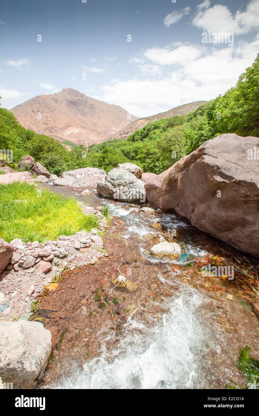 A snow-melt stream flowing down from Mt Toubkal near Imlil in the High ...