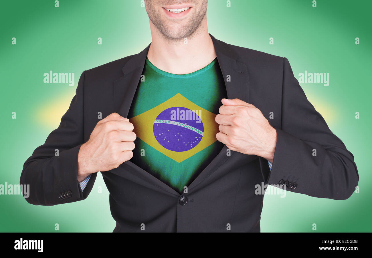 Businessman opening suit to reveal shirt with flag, Brazil Stock Photo ...