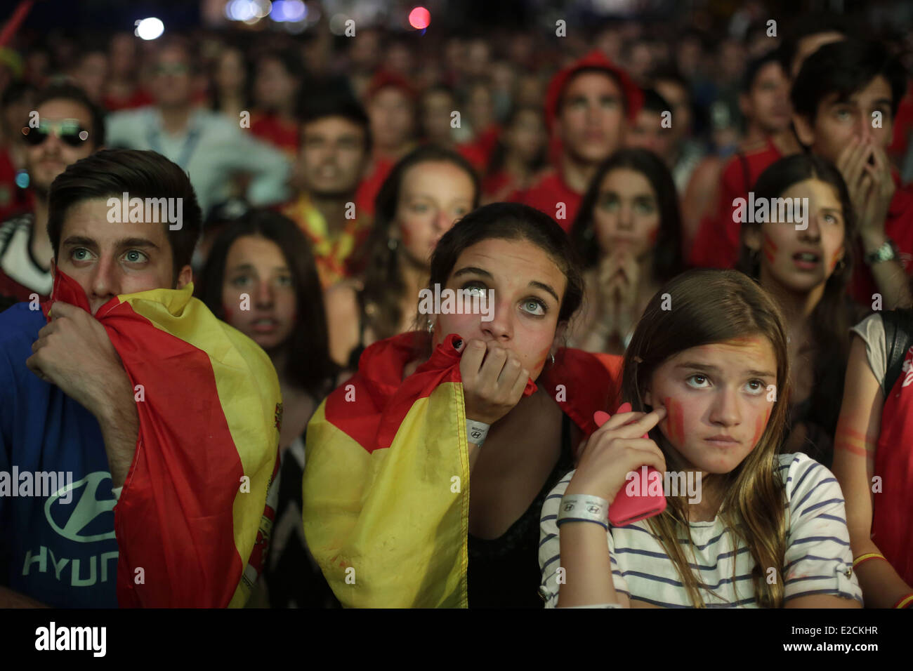 Madrid, Spain. 18th June, 2014. Spanish soccer fans gesture while ...