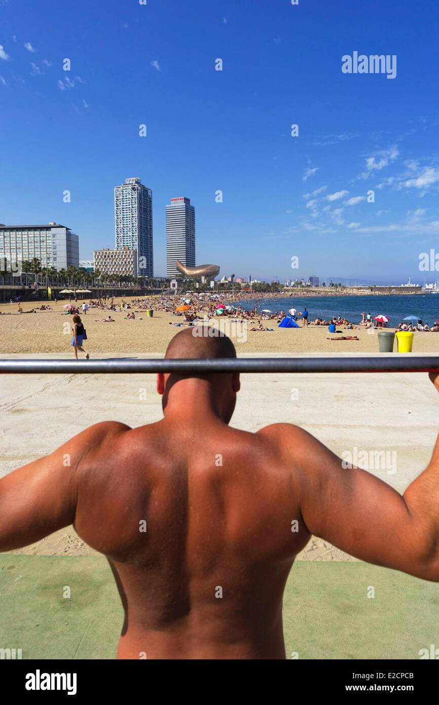 Spain Catalonia Barcelona Barceloneta beach bodybuilder training with ...