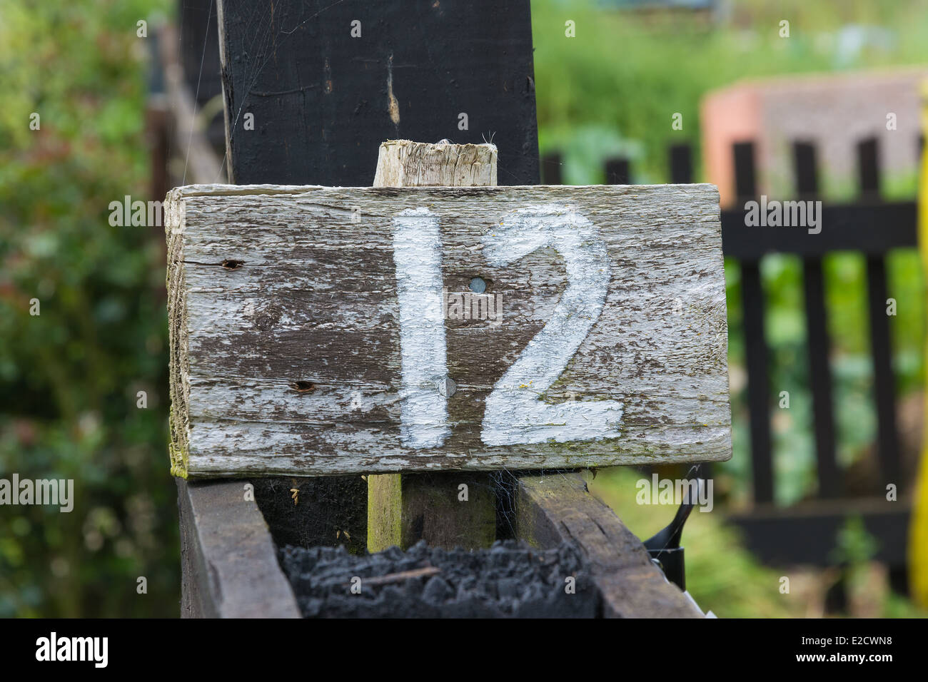 Wooden sign giving garden plot number Stock Photo - Alamy