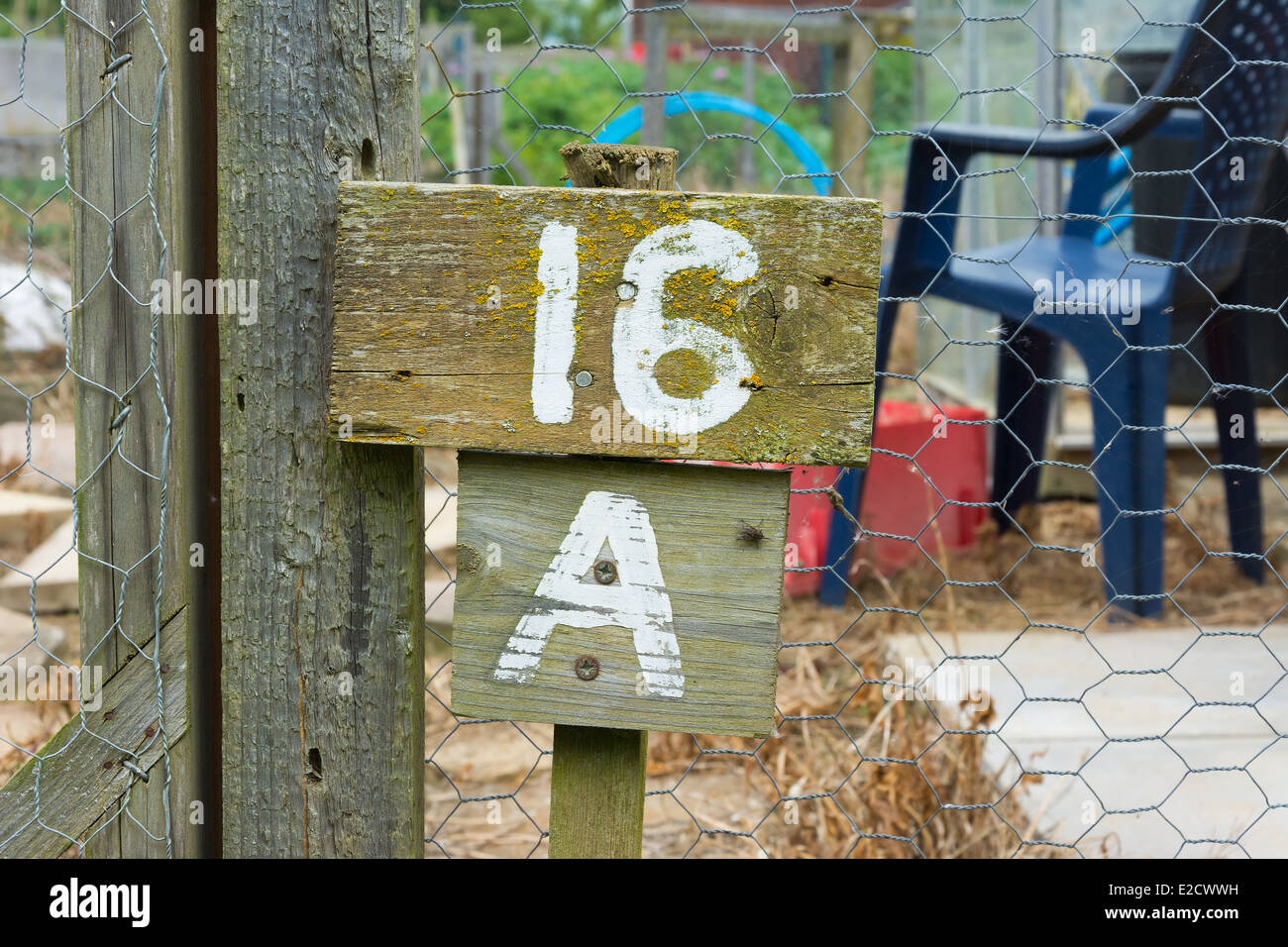 Wooden sign giving garden plot number Stock Photo - Alamy