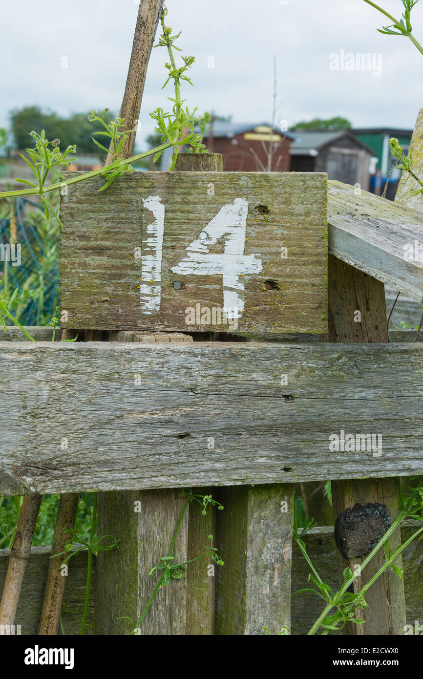 Wooden sign giving garden plot number Stock Photo - Alamy