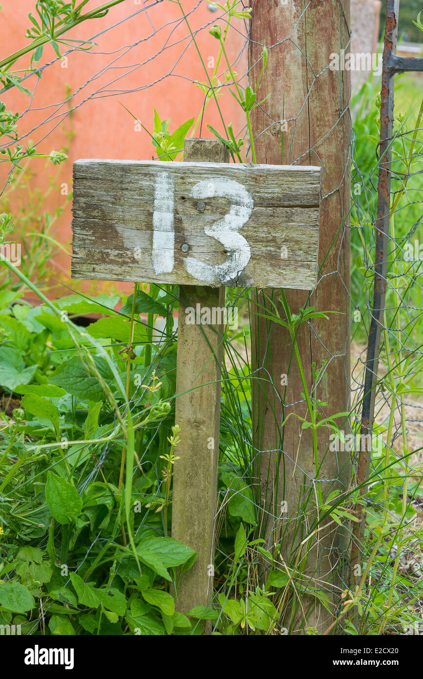 Wooden sign giving garden plot number Stock Photo - Alamy