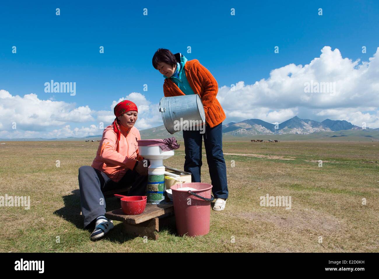 Kyrgyzstan Naryn Province women making butter on mountain pastures at ...