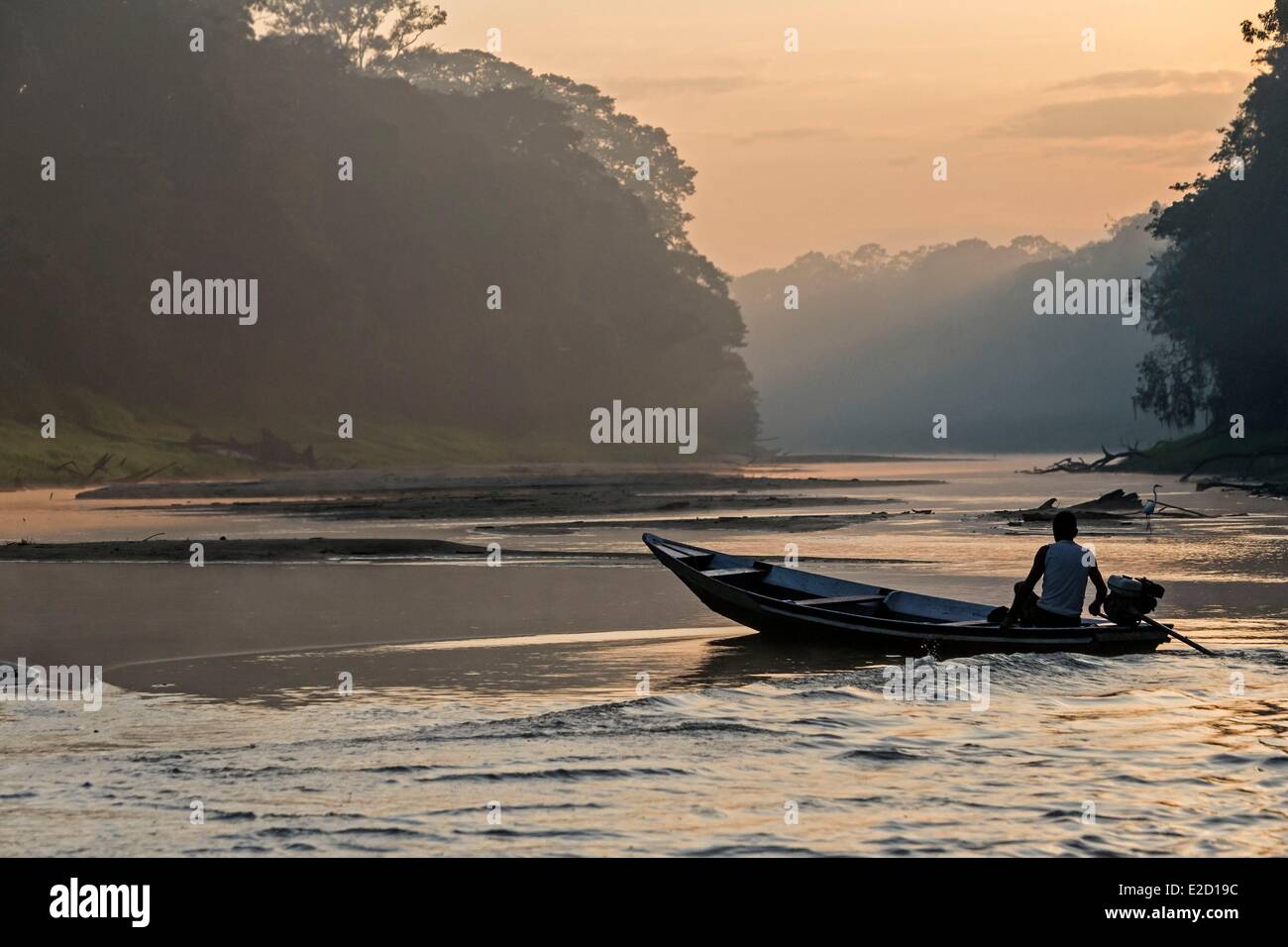 Brazil Amazonas state Amazon river basin rowboat sailing on a tributary ...