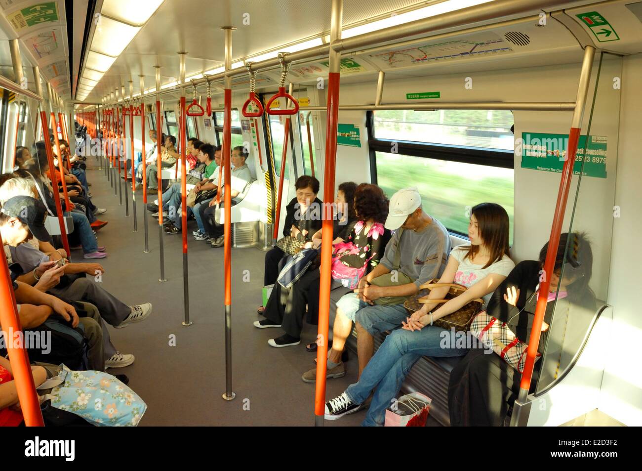 China Hong Kong MTR (Mass Transit Railway) passengers seated in the ...