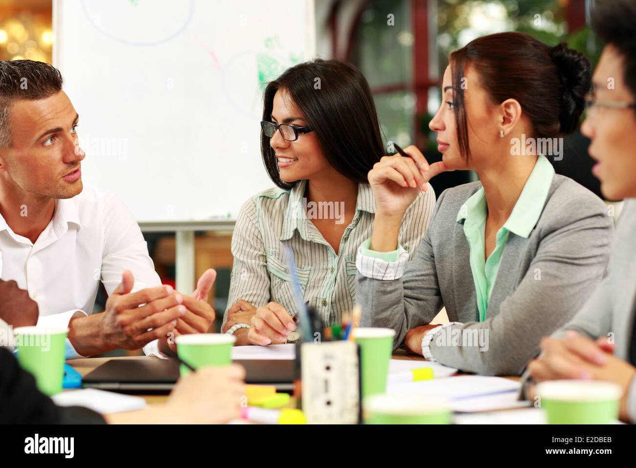 Business people working around table in office Stock Photo - Alamy Business people working around table in office Stock Photo - Alamy