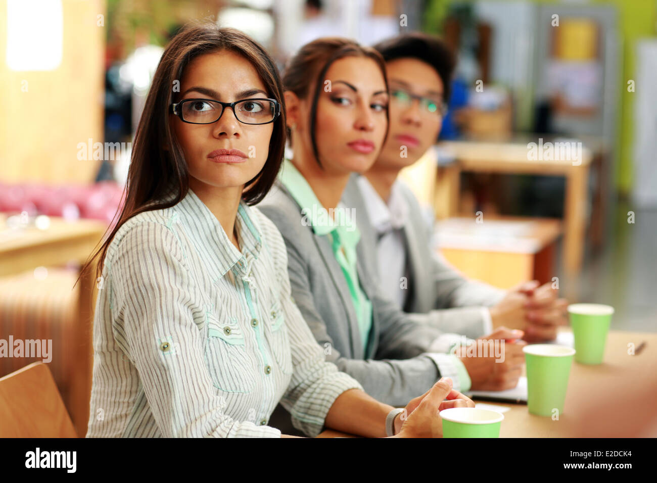 Business people sitting around a table during a meeting in office Stock ...