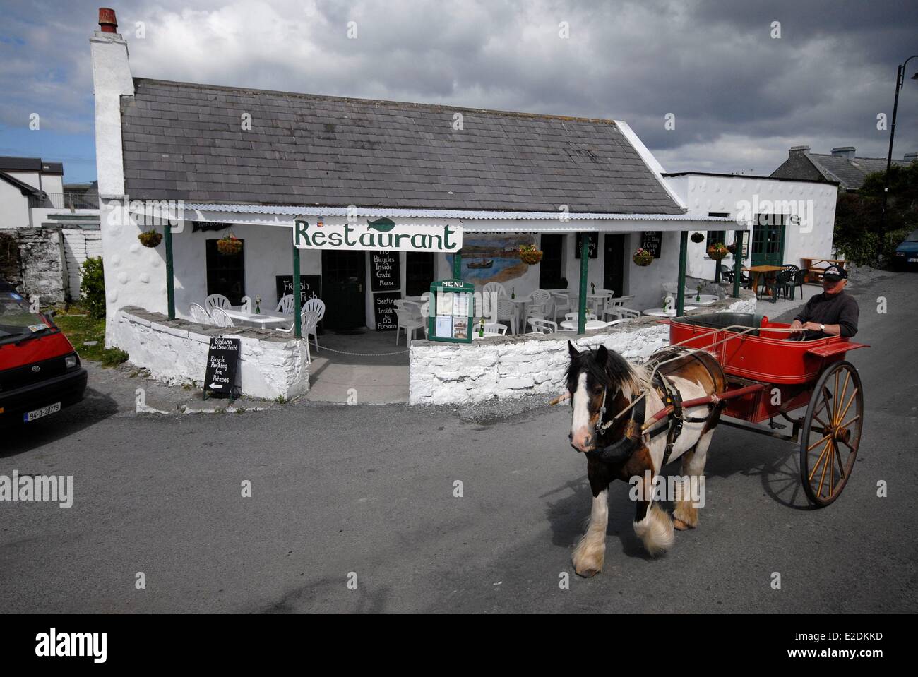 Ireland County Galway Aran Islands Inishmore Kilronan man driving a ...