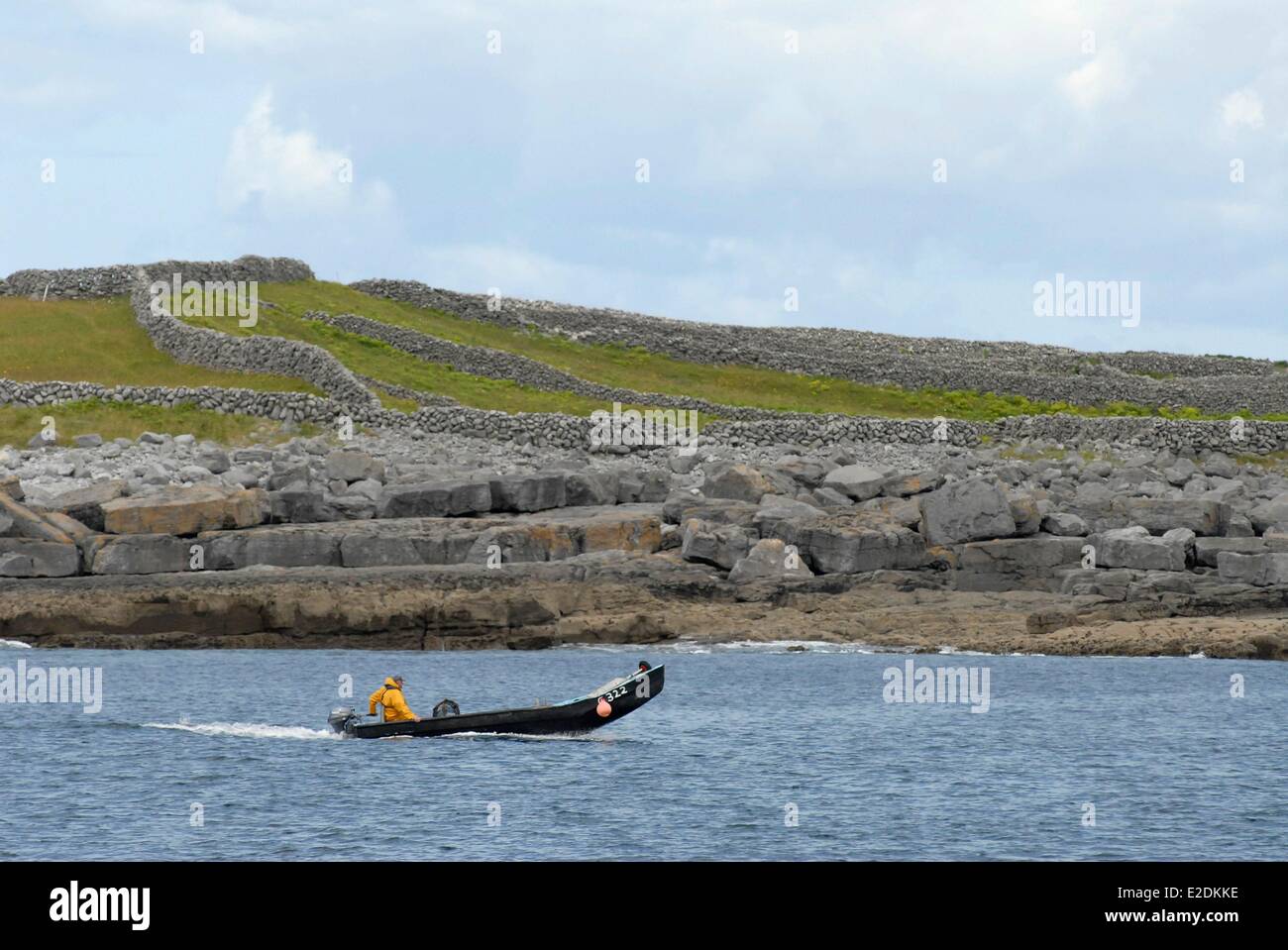 Ireland County Galway Aran Islands Inishmaan fisherman aboard a currach ...