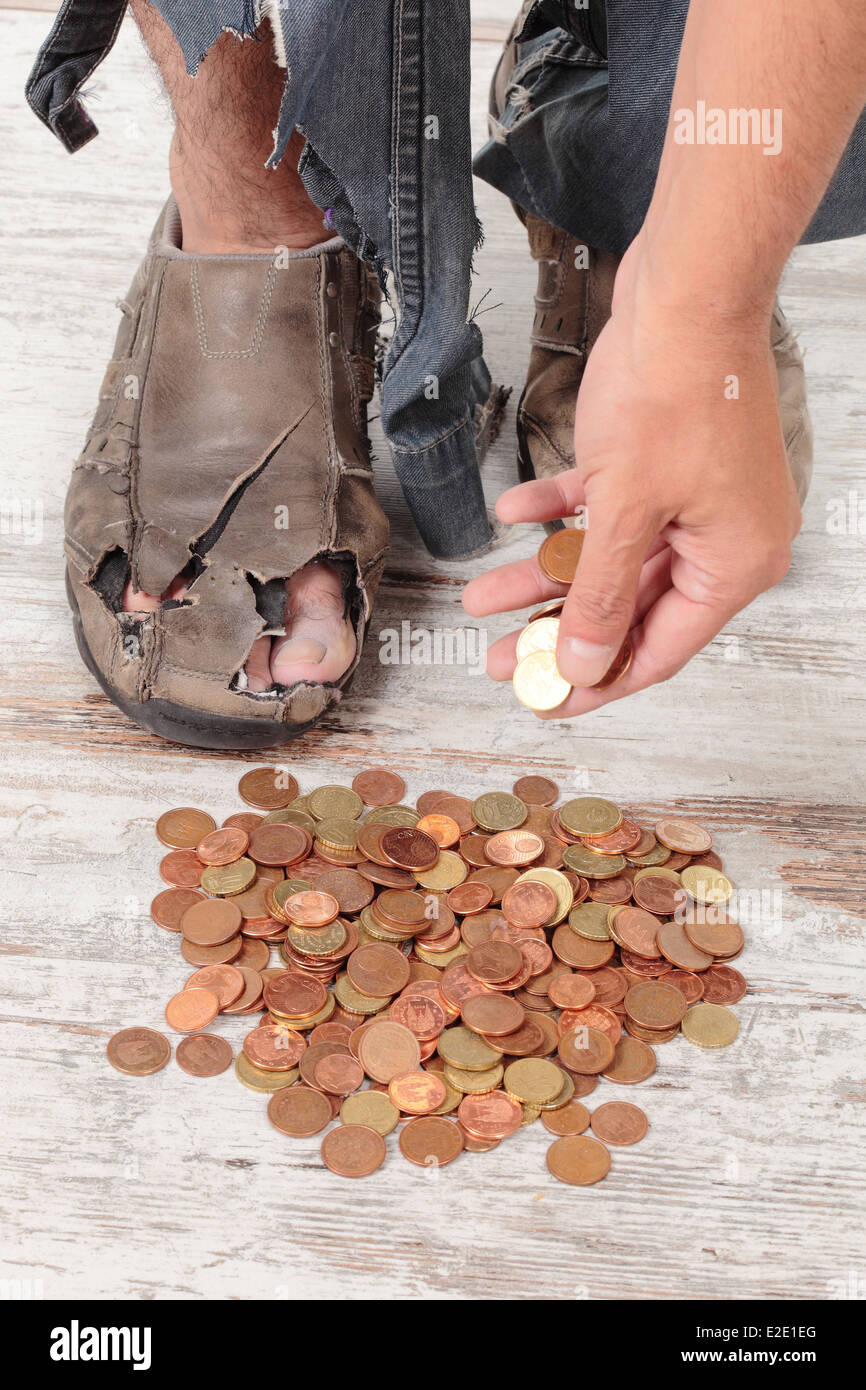 a poor hands taking some coins Stock Photo - Alamy