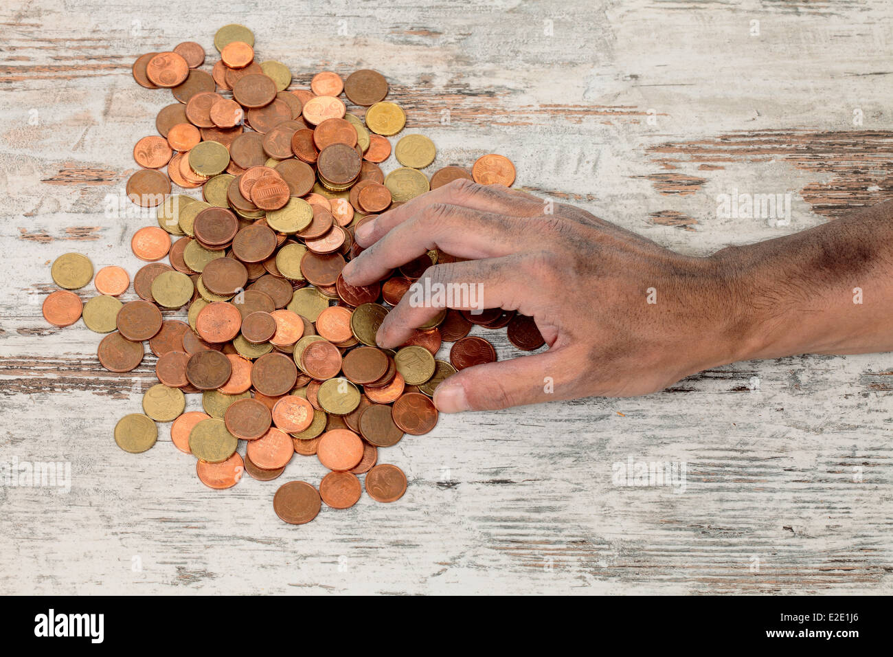 a poor hands taking some coins Stock Photo - Alamy