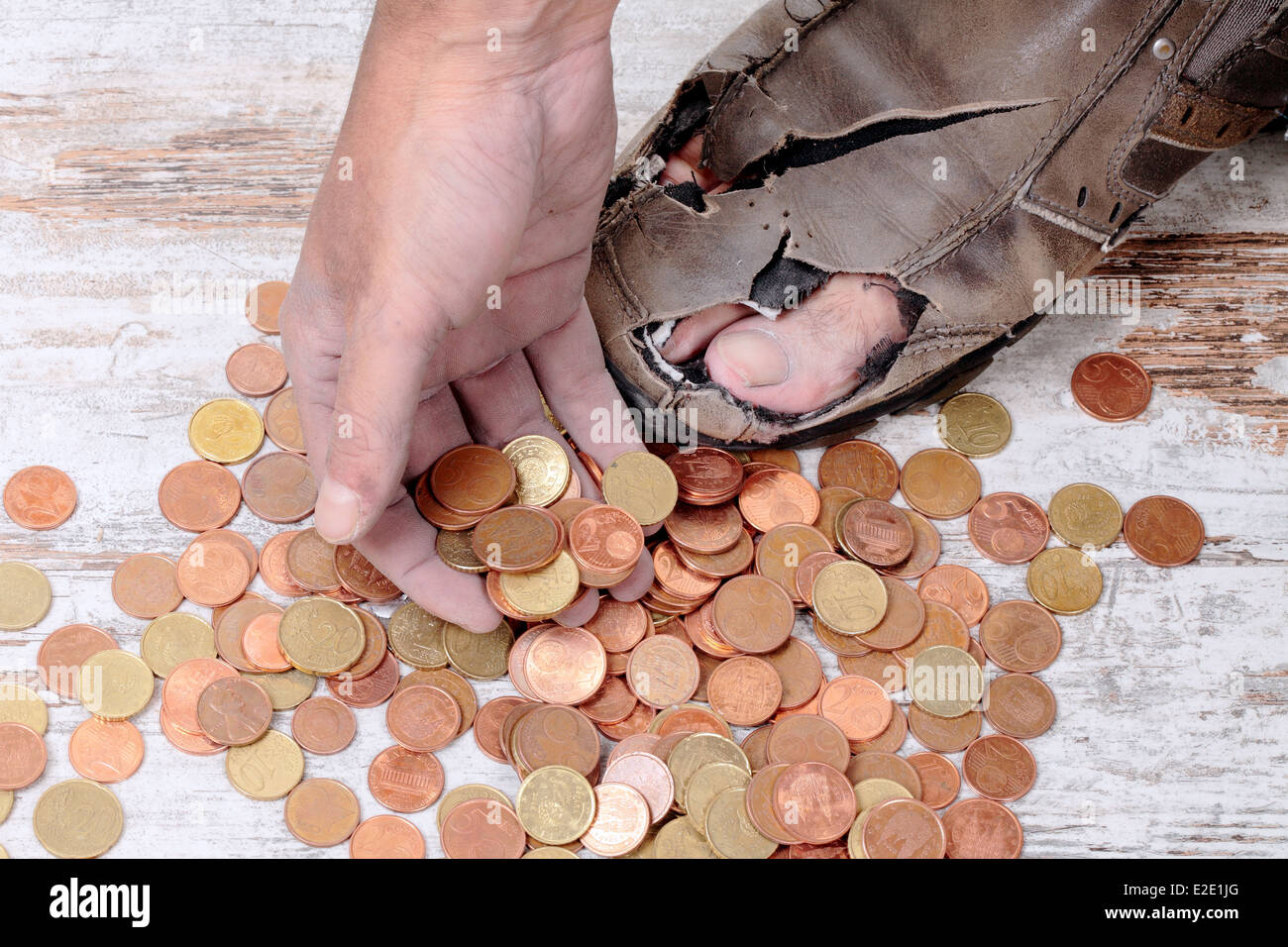 a poor hands taking some coins Stock Photo - Alamy