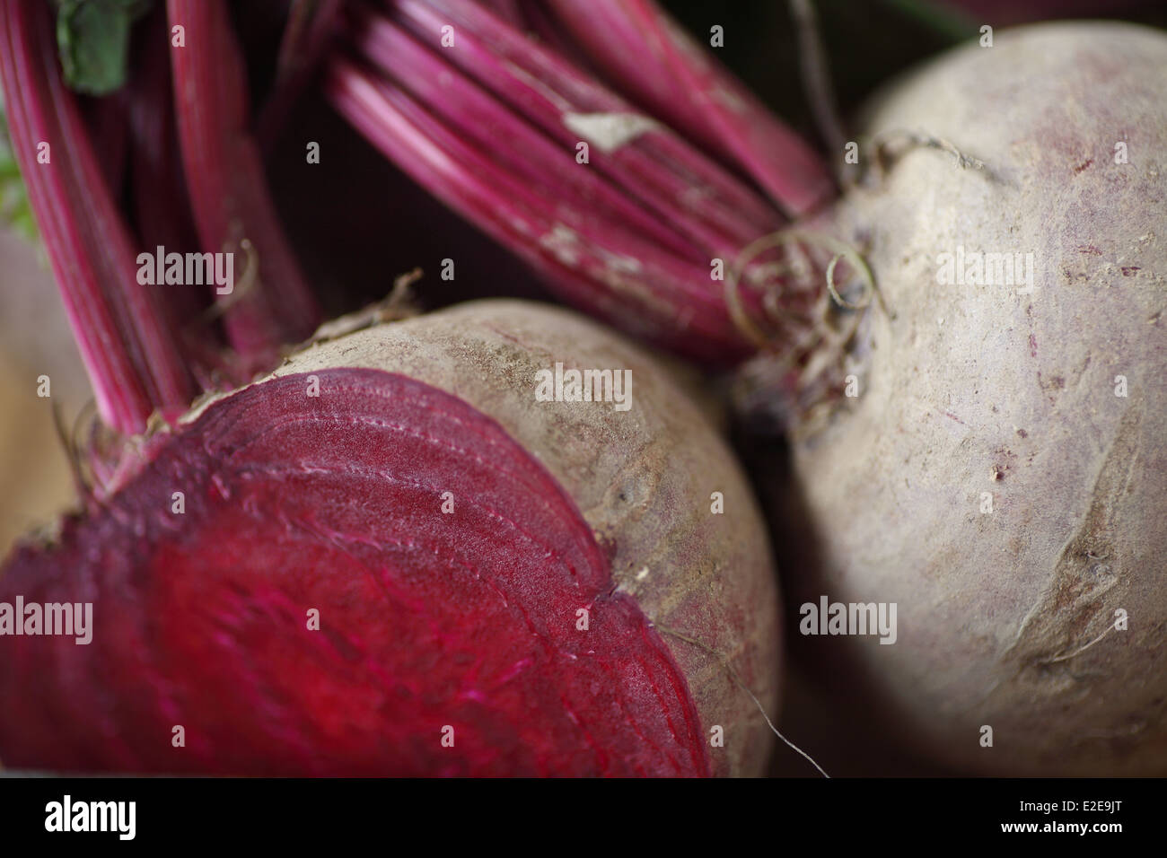closeup view of two red beets, one cut in half Stock Photo - Alamy