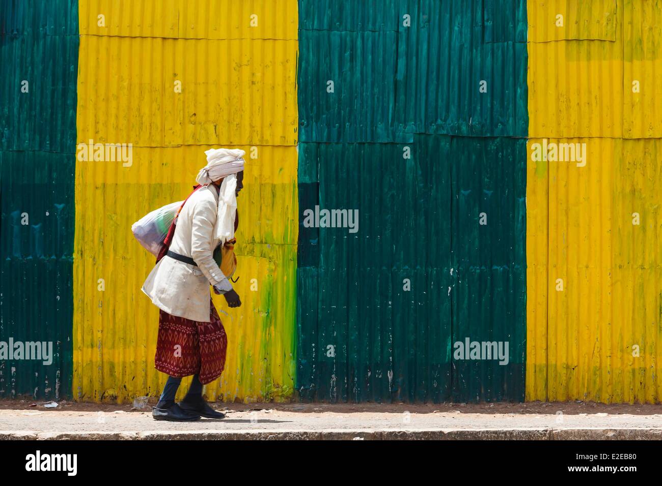 Ethiopia, Harar, listed as World Heritage by UNESCO, man before a sheet ...
