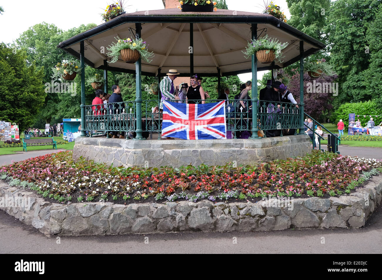 people using the bandstand in queen's park loughborough Stock Photo - Alamy