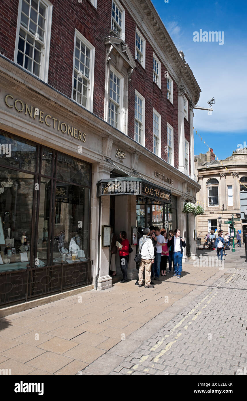 People queuing in line outside Bettys Cafe and Tea Rooms Davygate York ...