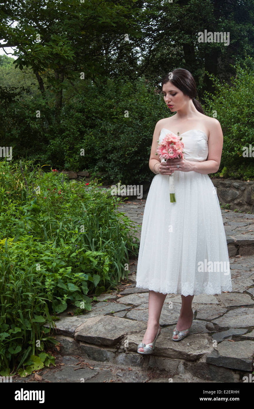 A bride walking down stone steps Stock Photo - Alamy