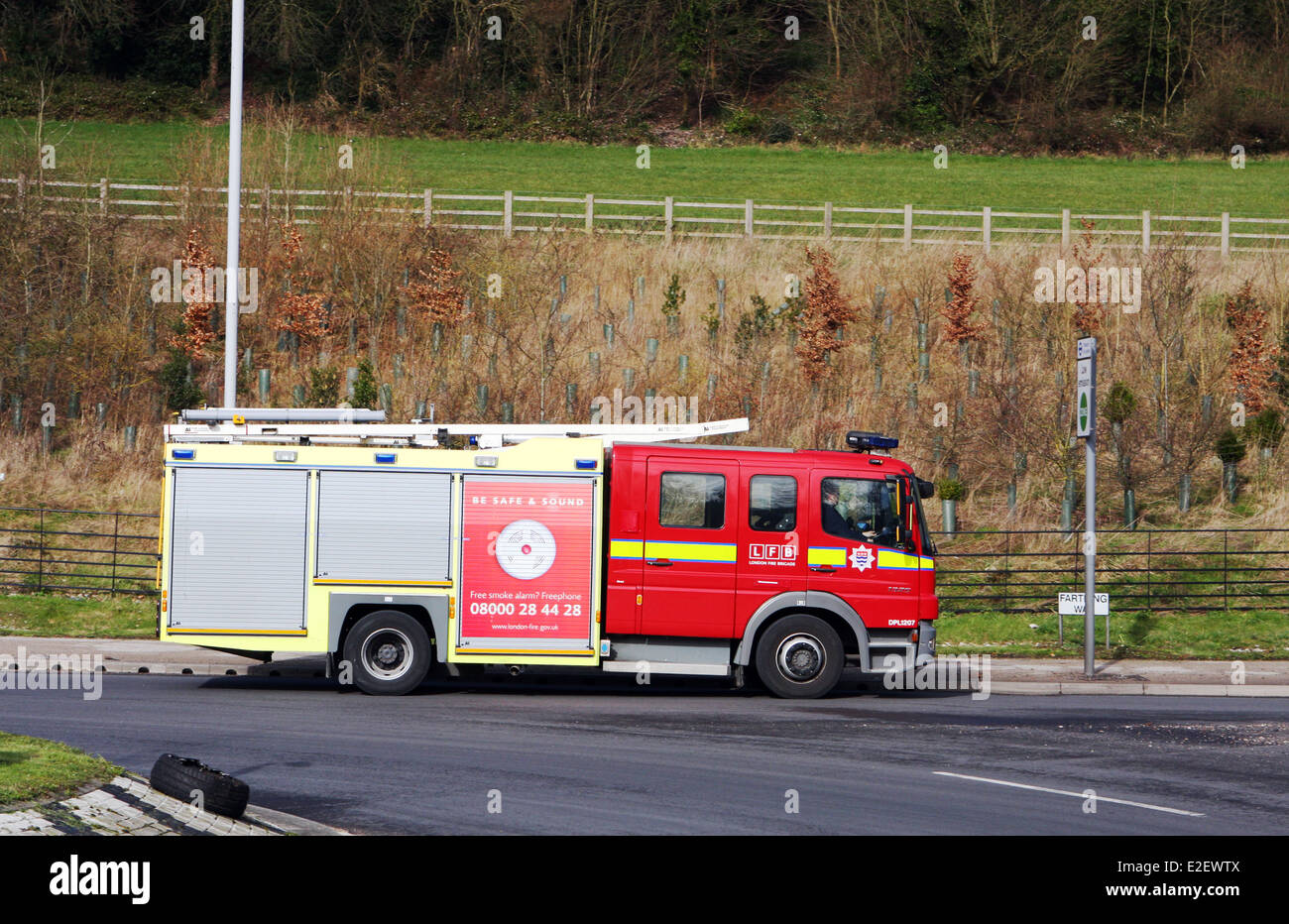 A fire engine exiting a roundabout in Coulsdon, Surrey, England Stock ...