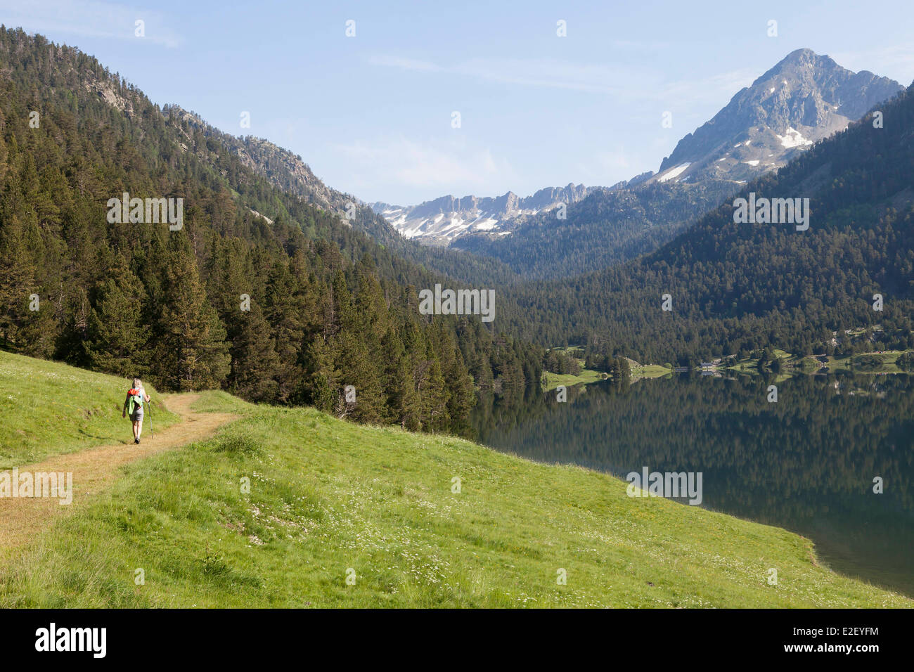 France, Hautes Pyrenees, Aragnouet, hiker on the GR10 footpath near the ...