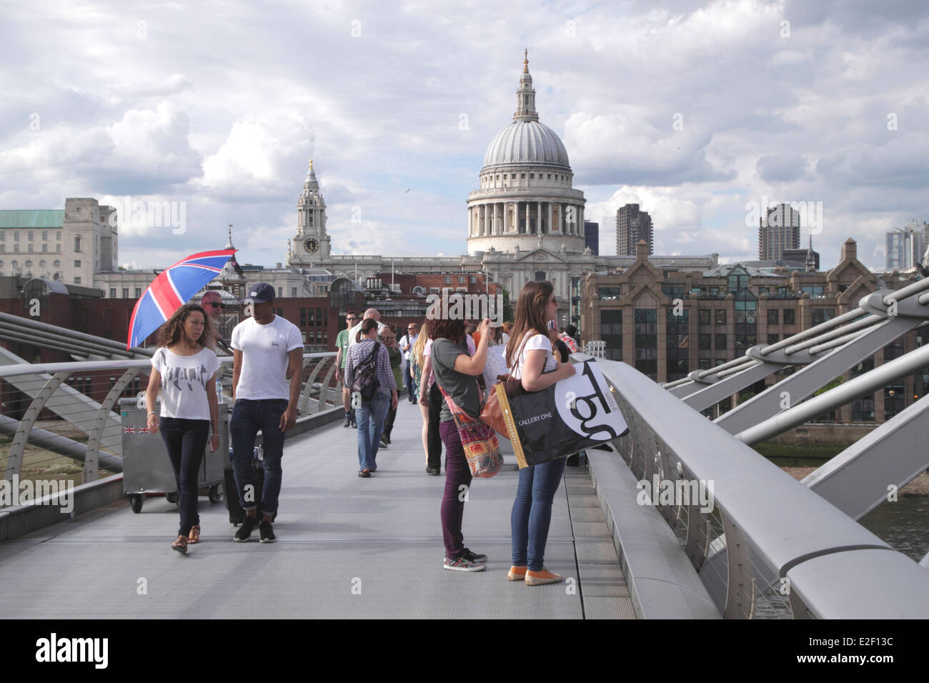 People walking on the Millennium Bridge London June 2014 Stock Photo ...