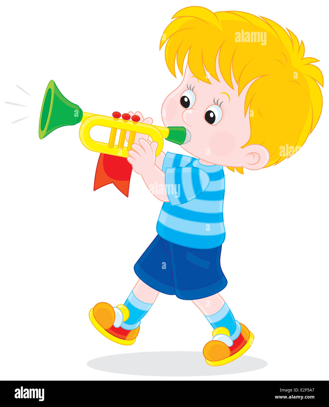 Boy blowing a small trumpet Stock Photo - Alamy