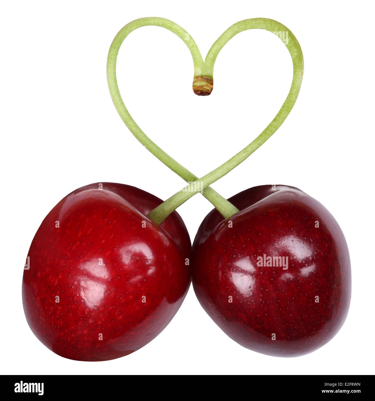 Two cherries forming a heart love topic, isolated on a white background ...