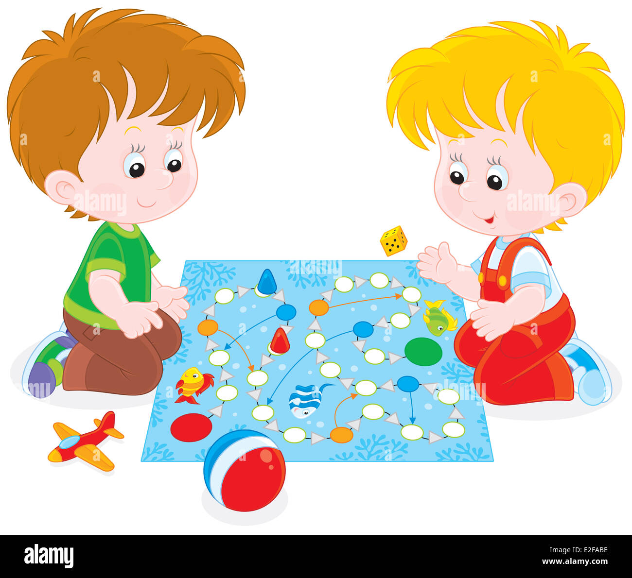 Boys playing with a boardgame Stock Photo - Alamy