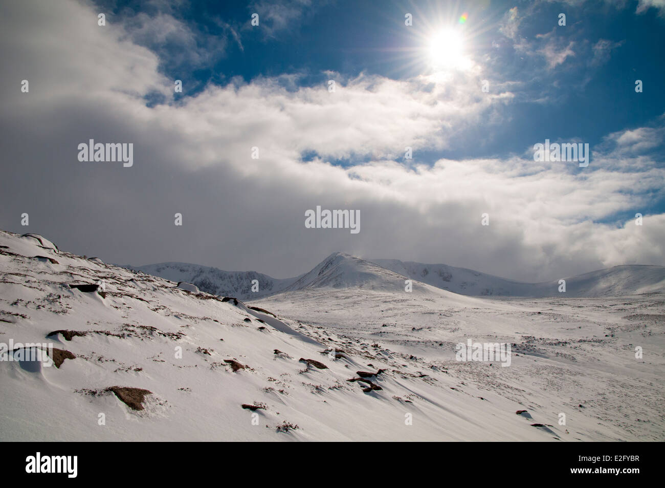 Clouds rolling over the snow-covered ridge of Fiacaill Coire an t ...