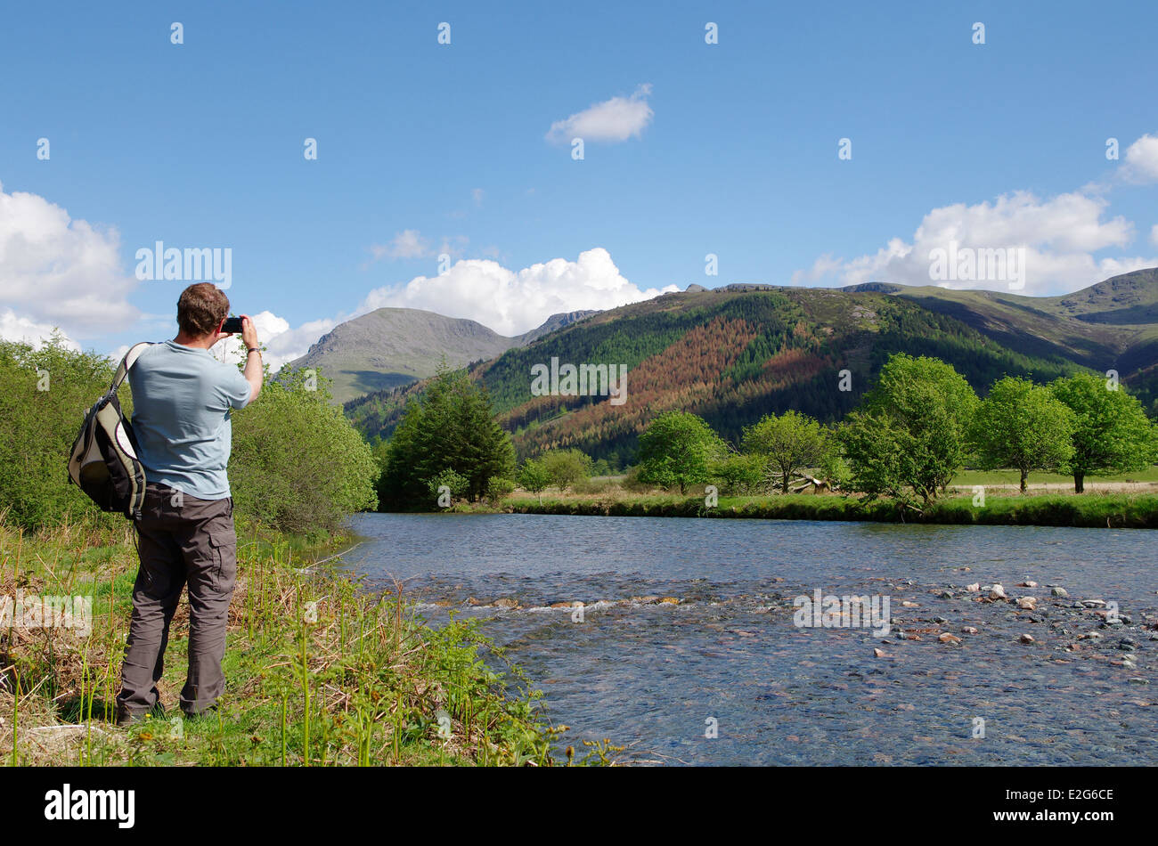Man Photographing the River Liza, Ennerdale Valley, Lake District ...
