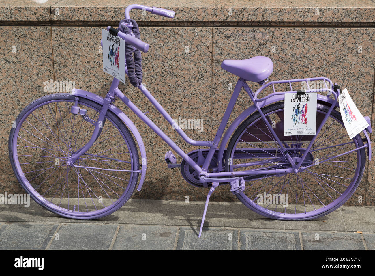 A photograph of purple bike in Antwerp, Belgium. Antwerp is a city in ...