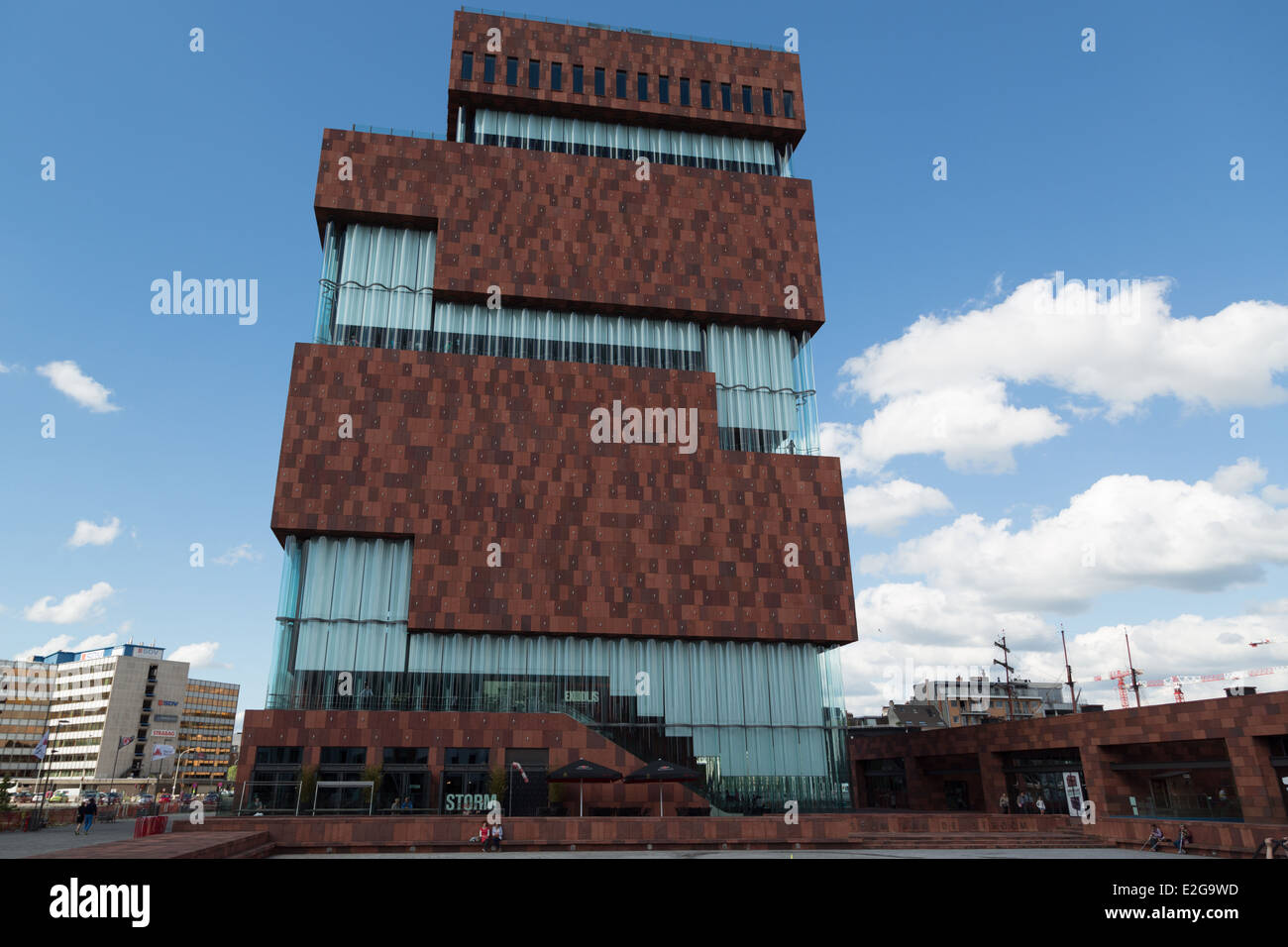 A photograph of the MAS museum in Antwerp, Belgium, against a blue sky ...