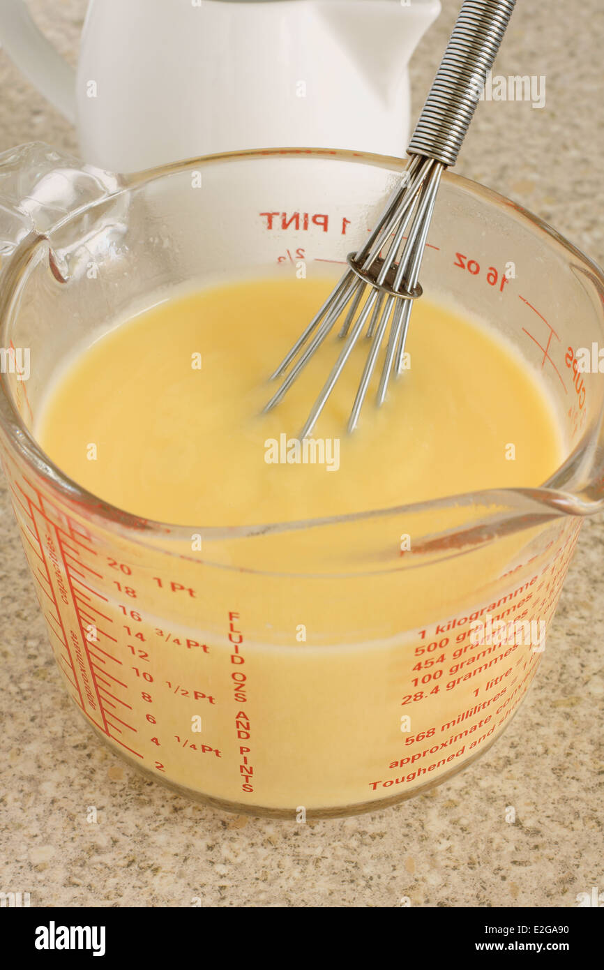 Dessert pouring custard on table hi-res stock photography and images ...