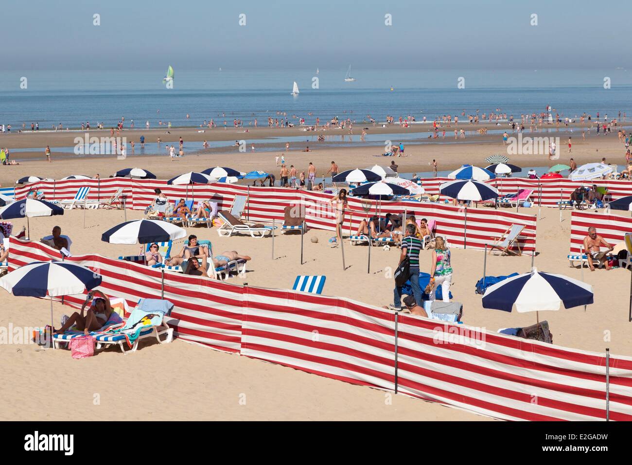 Belgium West Flanders De Haan beach huts sun loungers and parasols for ...