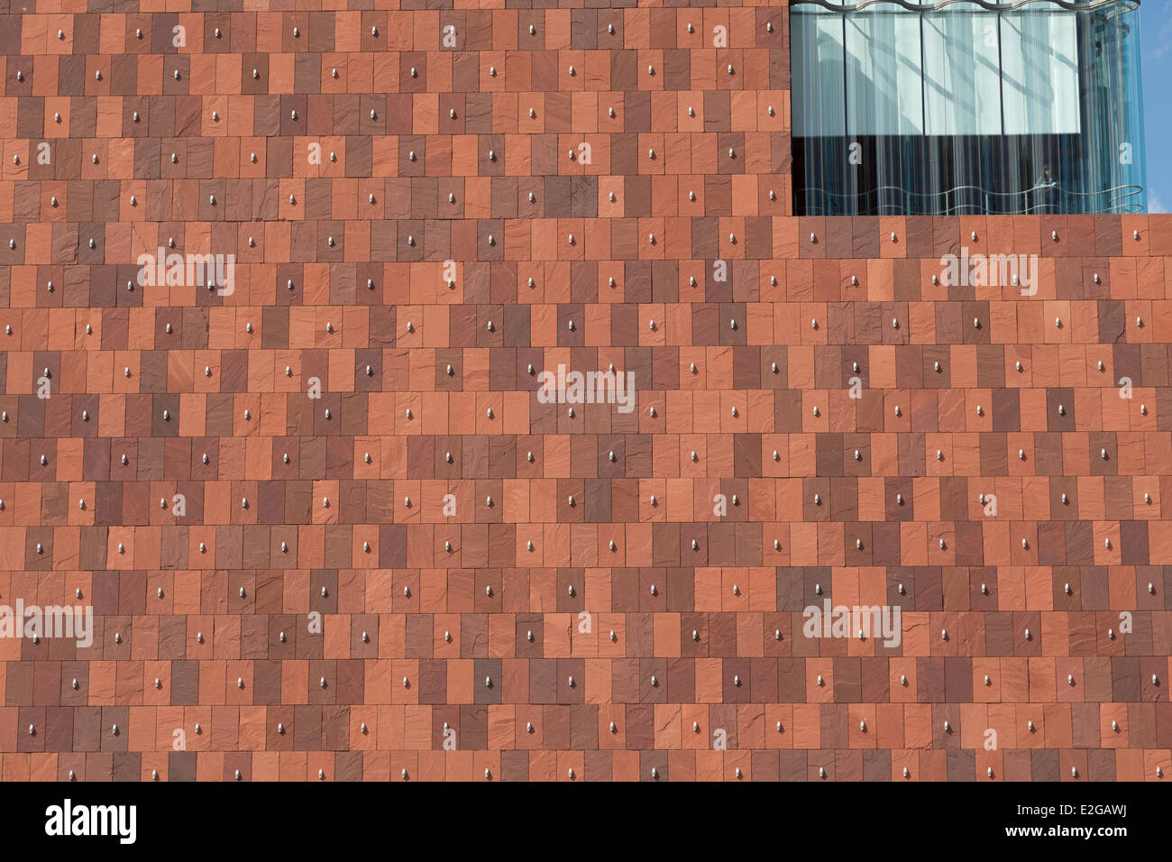 A close up photograph of the red sandstone walls of the MAS in Antwerp, Belgium Stock Photo - Alamy