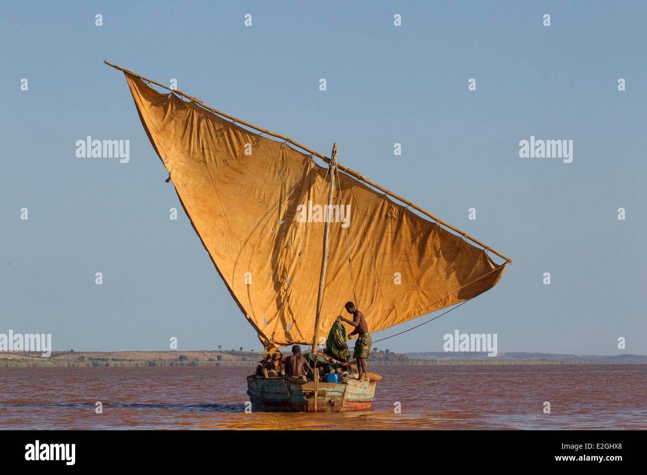 Madagascar Mahajunga Bombetoka Traditional boat carrying wood logs ...