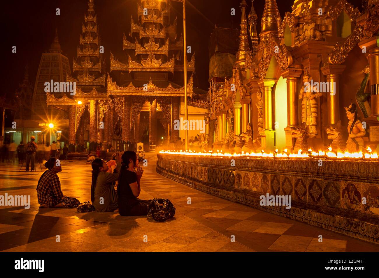 Myanmar (Burma) Yangon Division Yangon Shwedagon Pagoda women praying ...