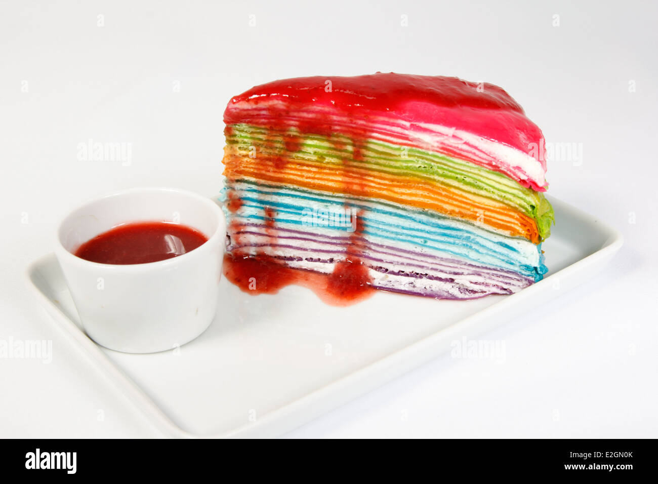 rainbow crape cake with strawberry source Stock Photo - Alamy