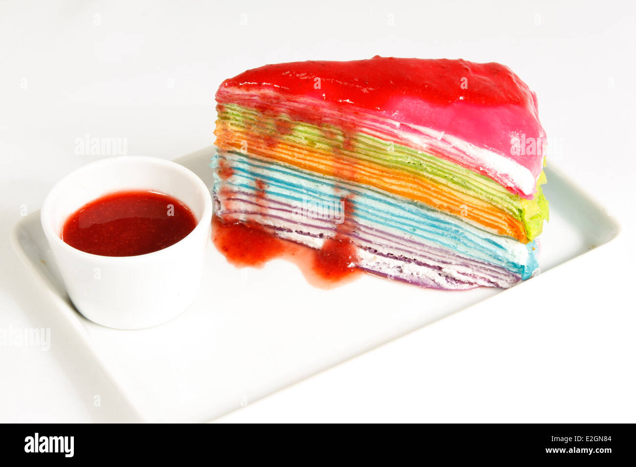 rainbow crape cake with strawberry source Stock Photo - Alamy